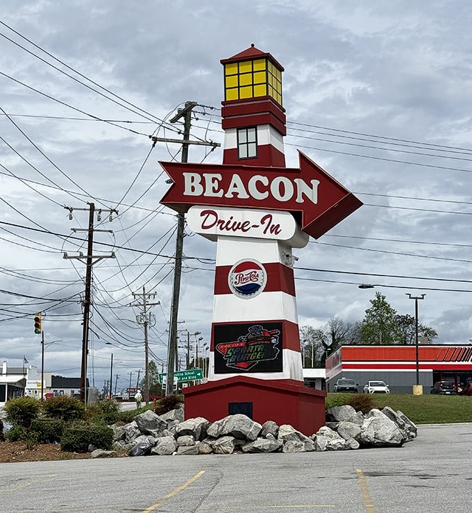 That lighthouse-inspired sign has guided hungry souls for decades. Not all beacons lead to shore—some lead to cheeseburger heaven.