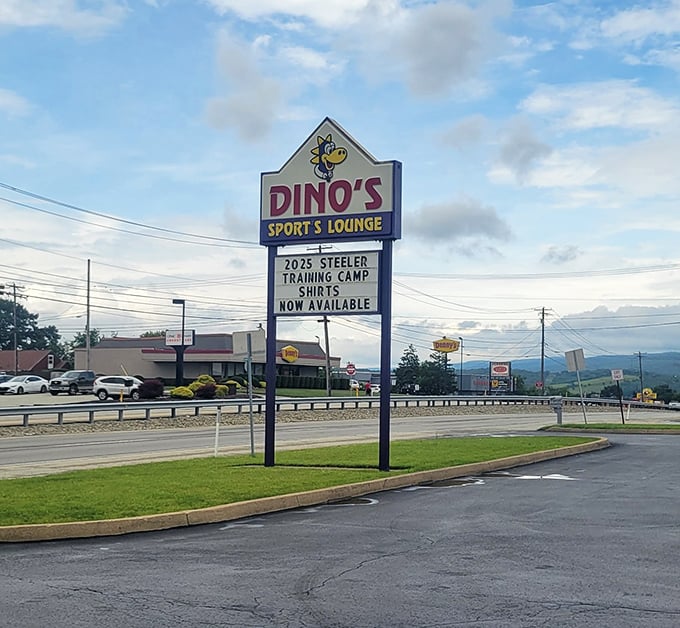 The beacon that guides hungry travelers home – Dino's sign stands tall against the Pennsylvania sky, promising comfort and satisfaction.