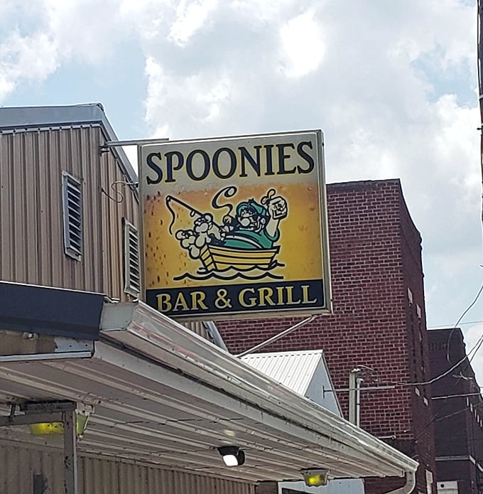 The sign that beckons hungry travelers like a lighthouse guiding ships to safe harbor—except this harbor is filled with delicious fried food instead of boats.