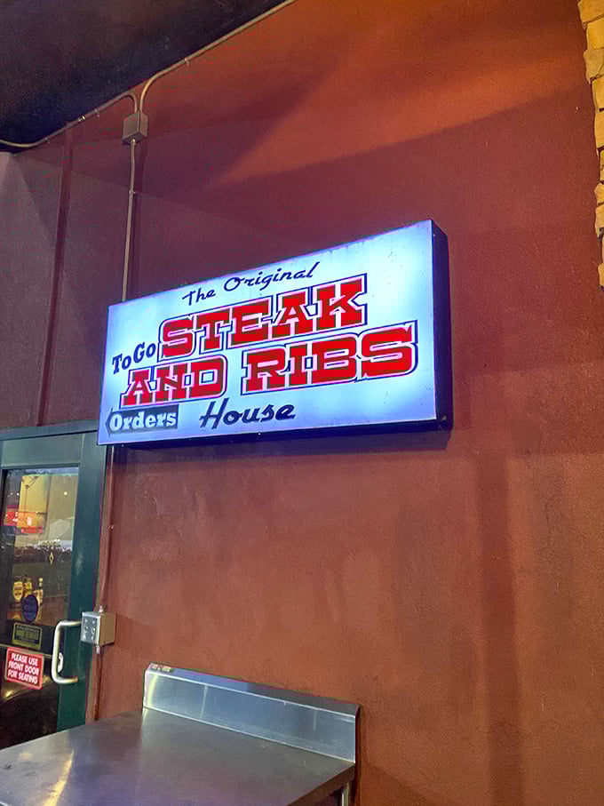 Even the to-go sign glows with promise—because sometimes the best dining room is your own couch, pants unbuttoned, dignity optional.