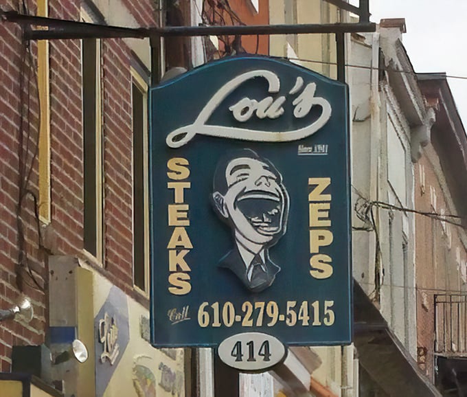 Lou's hanging sign has guided hungry travelers to sandwich salvation for decades. That laughing face knows you'll be back for more.