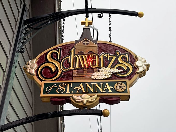 The iconic Schwarz's sign hangs like a beacon of hope for hungry travelers, promising relief from ordinary dining experiences.