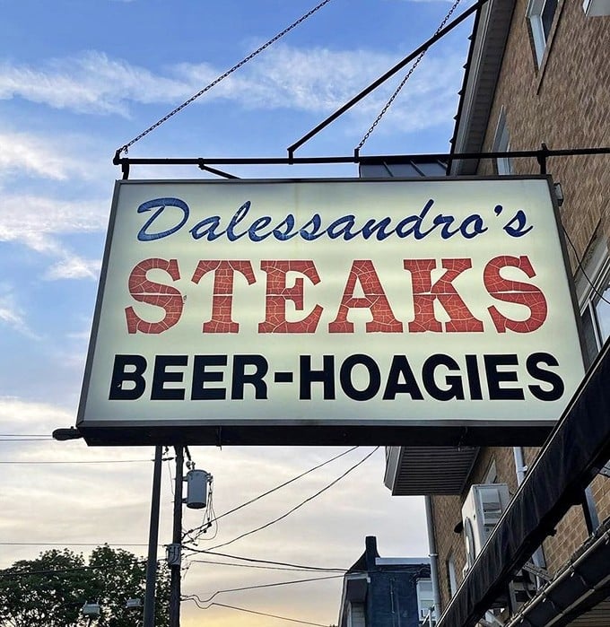 That sign against the blue sky—a beacon of hope for the hungry. Four simple words that promise culinary salvation.