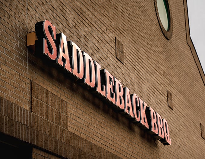 That distinctive signage against blue sky—a beacon of hope for the hungry, a landmark for the lost, and a promise of smoky satisfaction just steps away.