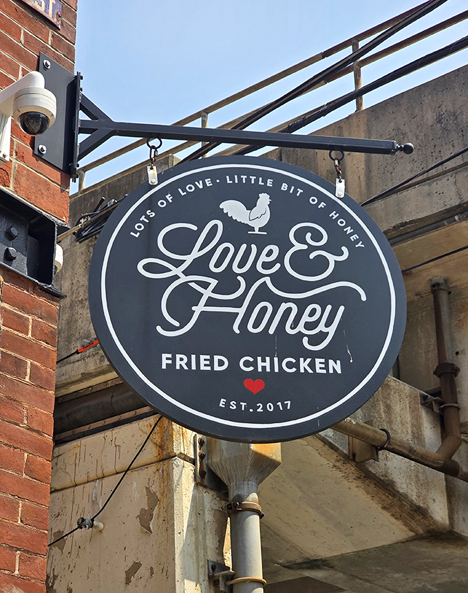 The hanging sign promises "Lots of Love, Little Bit of Honey"—perhaps the most honest advertising in the food business. That little red heart says it all.