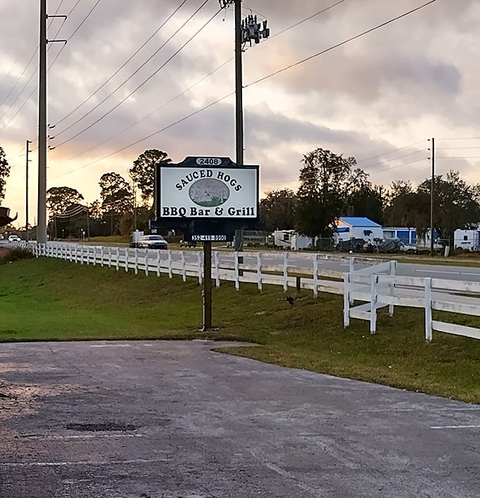 As the sun sets behind the Sauced Hogs sign, you realize some places just feel like home—if home smelled perpetually of oak smoke and happiness.