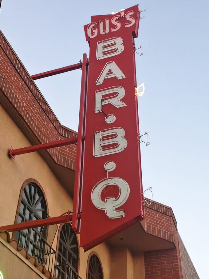 Not just a sign – it's a promise of smoky, saucy delights waiting inside. That vertical red beacon has been guiding hungry travelers for years.