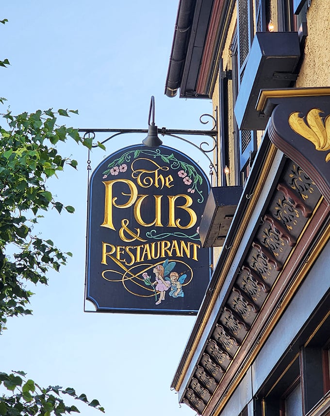 The vintage sign swinging gently above the sidewalk—a beacon for hungry travelers and locals alike, promising good times and better food inside.
