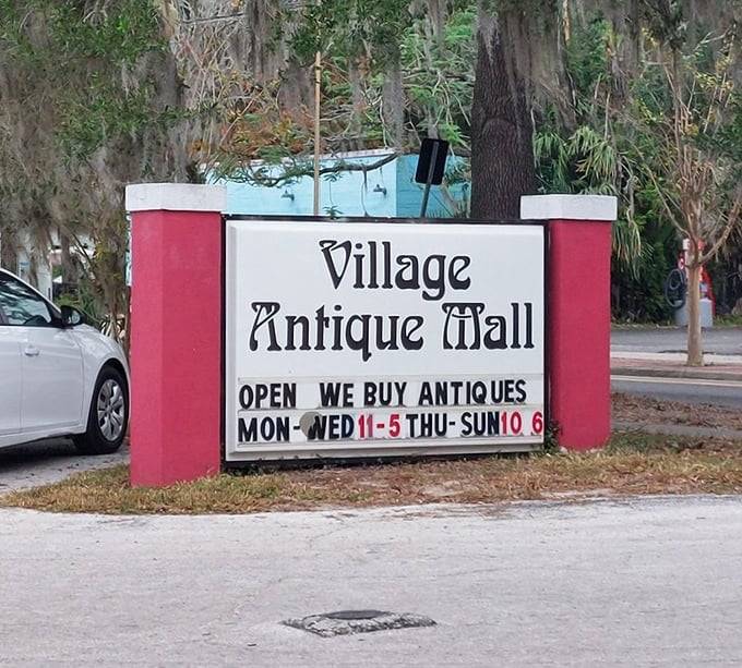 The sign says it all—Village Antique Mall welcomes visitors six days a week. Those Spanish moss-draped trees add the perfect Florida frame.