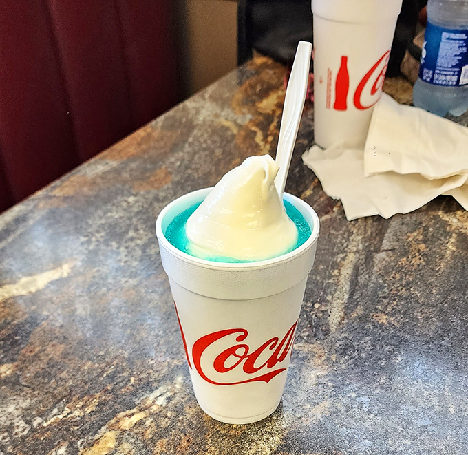 Not just a float, but a work of art—where vibrant blue meets creamy white in a cup that promises childhood nostalgia with grown-up satisfaction.
