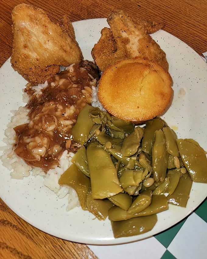 A plate that tells the whole Southern story—crispy fried chicken, tender green beans, and cornbread that crumbles just right when you break it open.