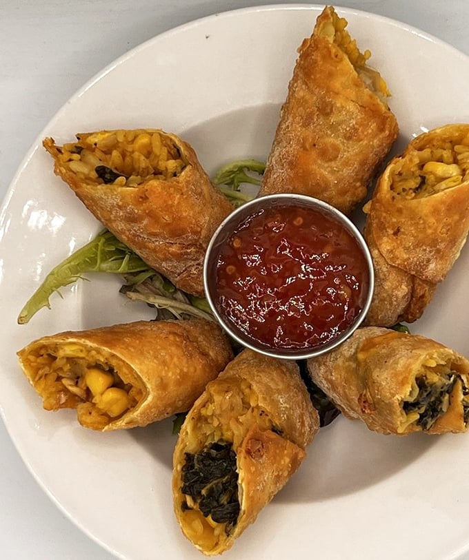 Egg rolls with a Southern drawl – crispy wrappers hiding treasures of collards and corn that prove fusion food can have both roots and wings.