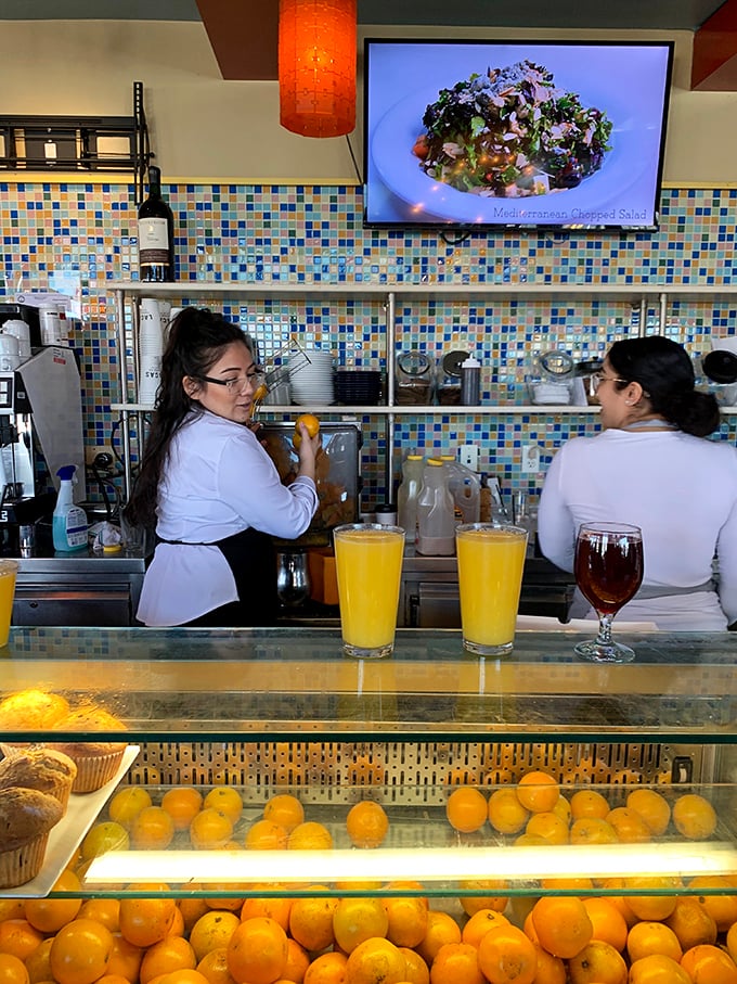 Behind the counter, fresh-squeezed juices and pastries await – where staff orchestrate the morning ritual that powers New Jersey's day.
