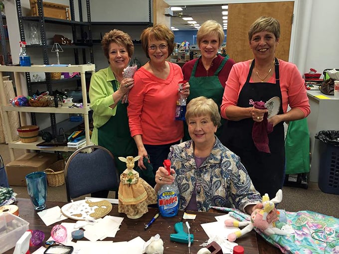 The heart of any great thrift operation—dedicated volunteers crafting and creating behind the scenes. Their smiles tell you this is more than just a job.