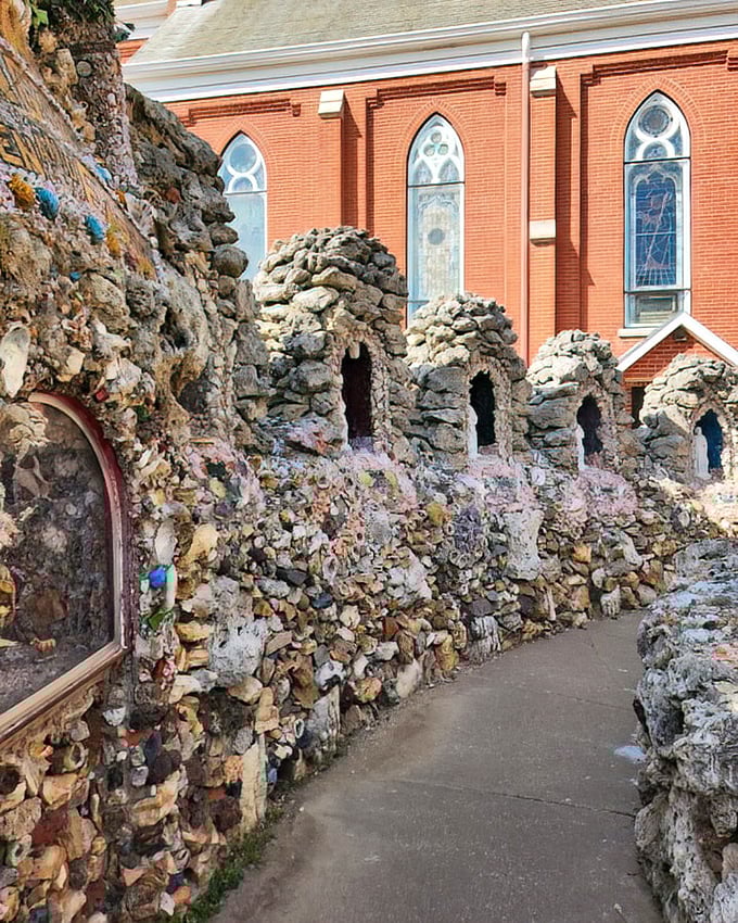 Stone structures frame the church's brick facade, creating a contrast that's like seeing Bach performed by a rock band—surprisingly perfect.