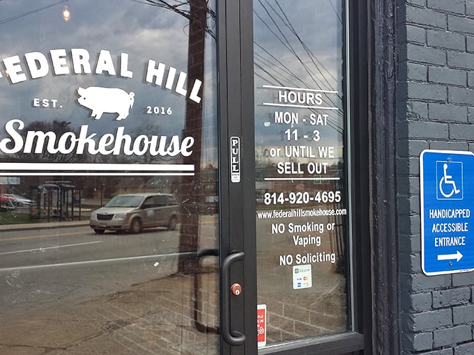 The door tells the whole story: "11-3 or until we sell out" – six words that separate casual eateries from serious barbecue institutions committed to freshness.