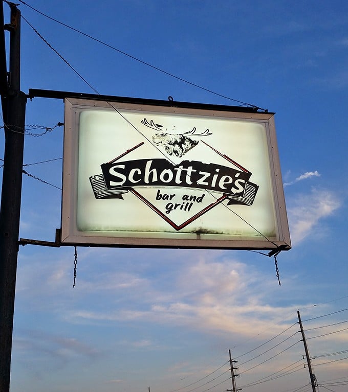 The vintage sign featuring a moose silhouette stands as a beacon for the hungry and adventurous—a landmark of local culinary tradition.
