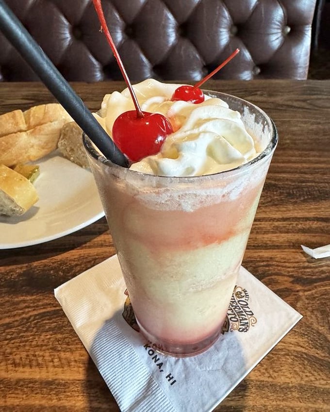 A strawberry colada that looks like summer in a glass. The kind of drink that makes you want to send a postcard saying, "Wish you were here!"