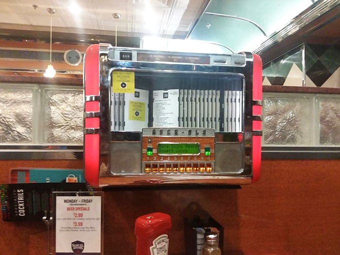 The tabletop jukebox – a time machine disguised as a music box, ready to soundtrack your meal with hits from simpler times.