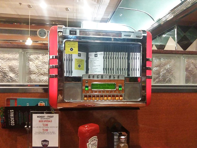 The tabletop jukebox – a time machine disguised as a music box, ready to soundtrack your meal with hits from simpler times.