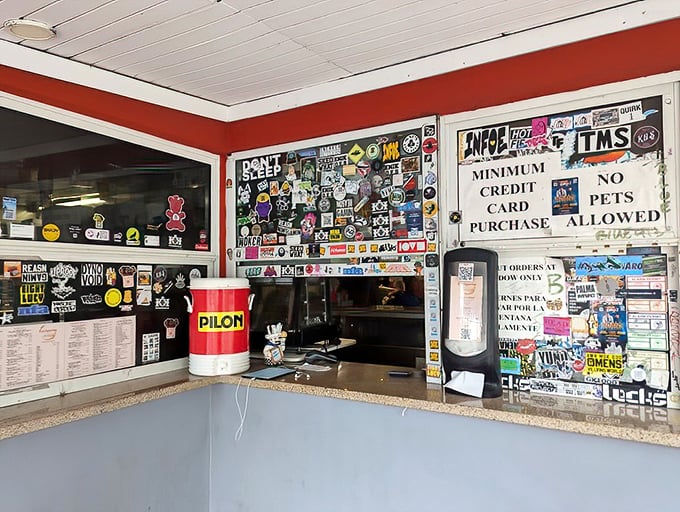 The take-out window, plastered with stickers and memories, serves as Enriqueta's mission control for hungry Miamians on the move.