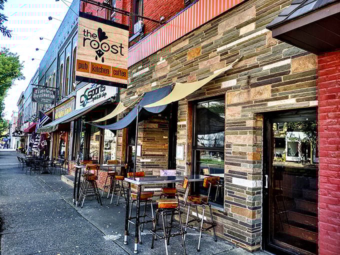 The Roost combines stone façade charm with outdoor dining perfection. Those industrial stools aren't just trendy—they're front-row seats to Wellsboro's daily parade.