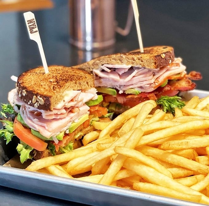 This sandwich isn't messing around—stacked higher than your weekend to-do list and twice as satisfying when you finish it.