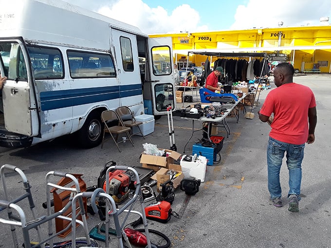 The outdoor vendor area resembles an urban yard sale on steroids, where power tools and household items await their second chance at usefulness.