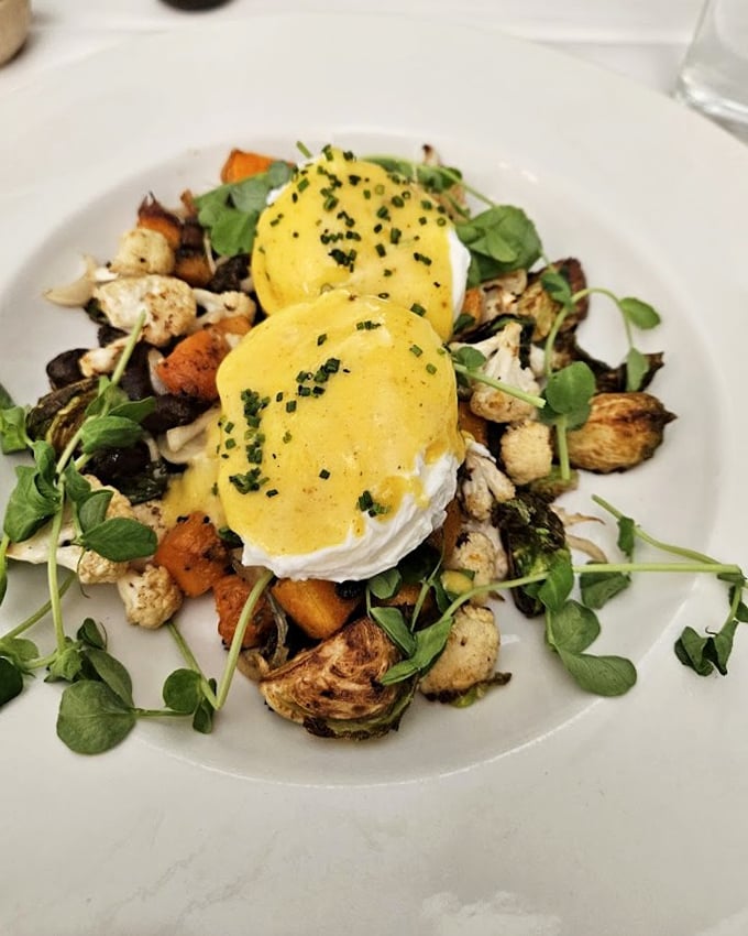 Poached eggs crown this vegetable hash like royal jewels, proving that brunch at Bolete isn't just a meal – it's a weekend achievement worth documenting.