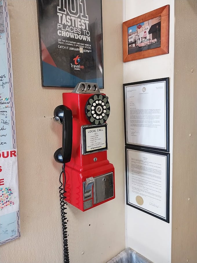 Even the vintage payphone seems to whisper, "Call everyone you know—they need to experience these sliders at least once in their lifetime."