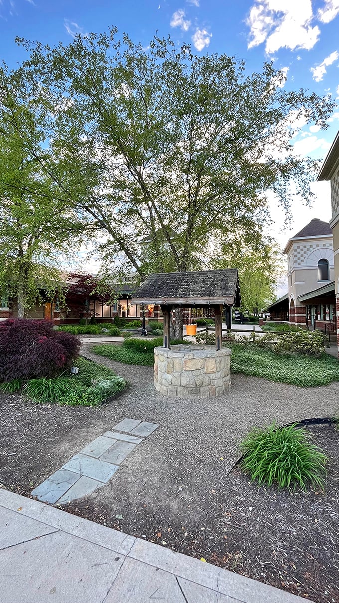 A wishing well surrounded by landscaping—toss in a penny, wish for sales, and marvel at this mall's commitment to aesthetic charm.