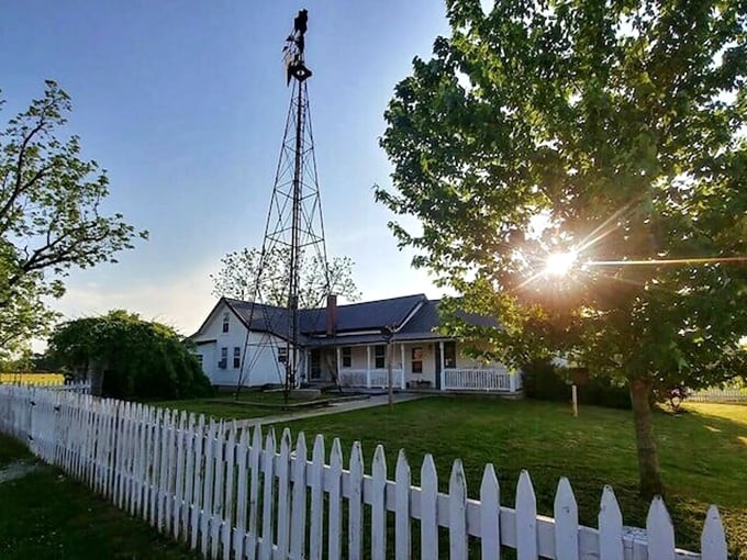 As the sun sets behind this classic farmhouse with its white picket fence, you'll understand why some choose to keep life beautifully, intentionally simple.