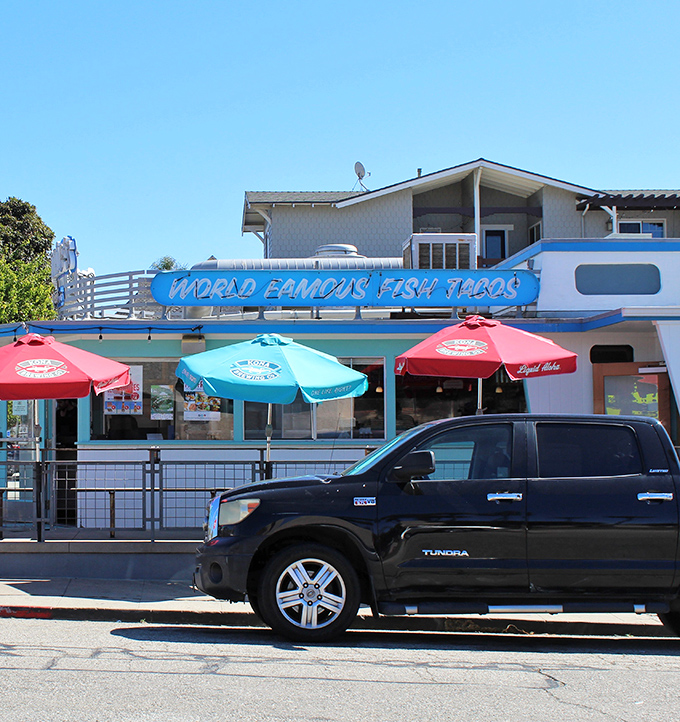 Even from across the street, that iconic blue sign serves as a lighthouse for hungry souls seeking California's coastal cuisine at its unpretentious best.