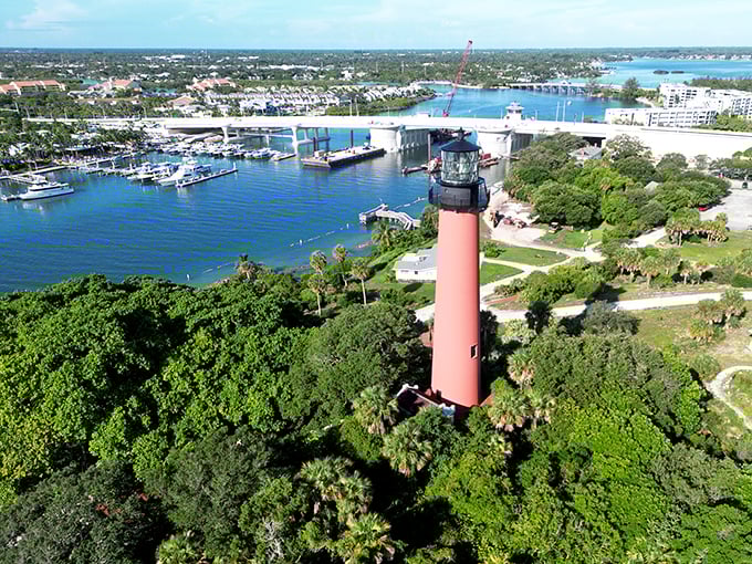 The aerial view reveals Jupiter Inlet's perfect marriage of natural beauty and historical significance—Florida showing off its best assets from above.