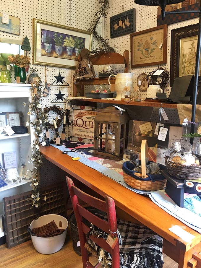 Country charm meets artistic flair in this cozy vendor booth. That handmade quilt sign and rustic workbench would make Martha Stewart drop her gardening shears in excitement.