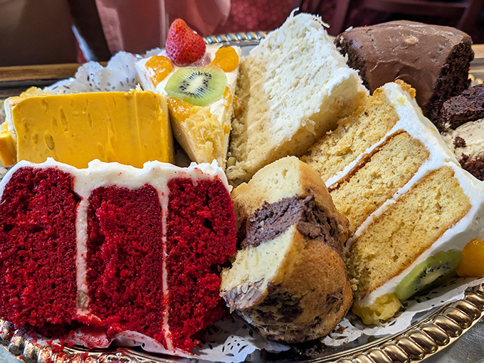 The dessert sampler that launches a thousand diet breaks—a rainbow of cakes that makes choosing just one flavor impossible.