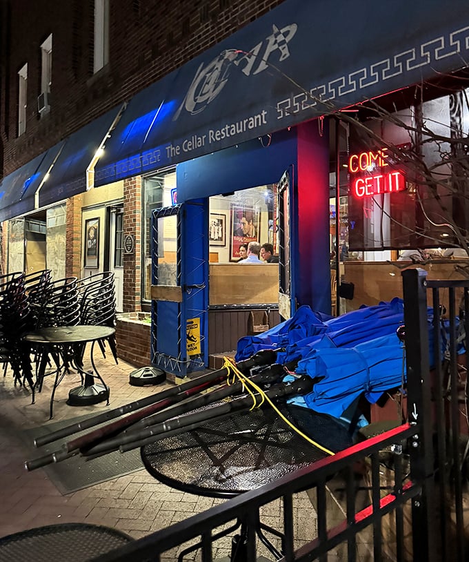 By night, The Cellar's neon "COME GET IT" sign isn't just an invitation – it's practically a command from the culinary gods.