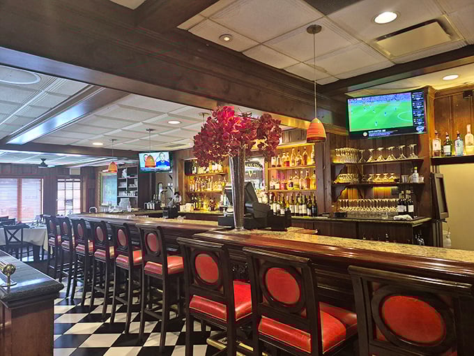 The bar area offers a more casual vibe with the same commitment to quality. Those red-backed stools have supported generations of satisfied diners.