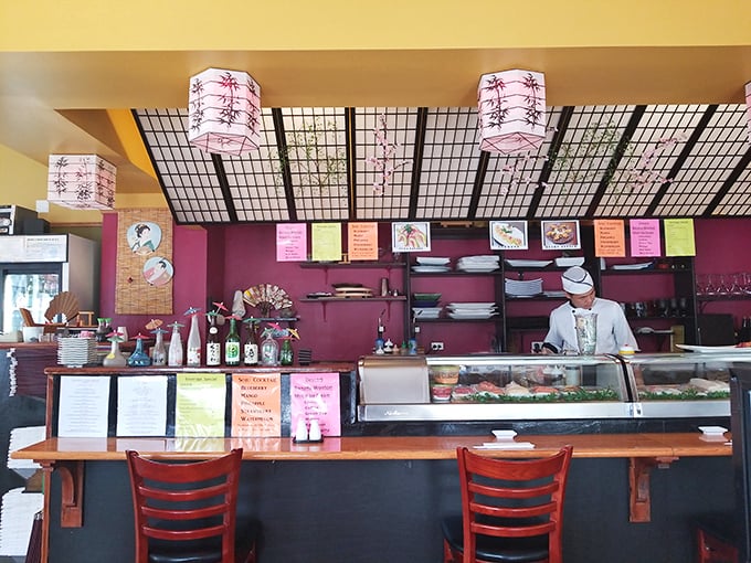 The sushi bar – where magic happens behind a simple counter, proving once again that the best theater in town involves food.