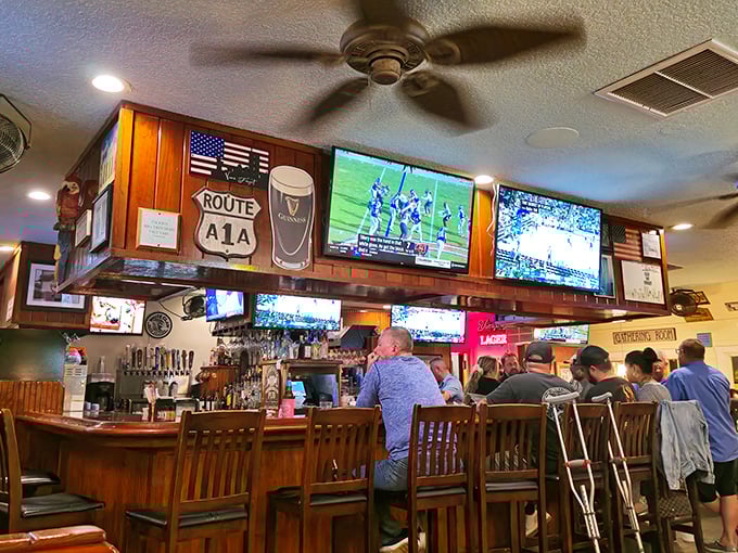 The bar area, with multiple screens and Route A1A signage, creates that perfect "neighborhood joint" feel where everyone's welcome and nobody's rushing.