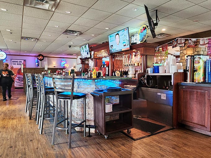 The bar at Ron's Roost—where locals have been solving the world's problems over cold beers and hot food since before flat-screen TVs existed.