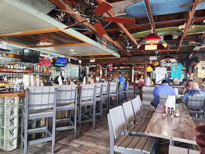 The bar at JB's isn't just serving drinks; it's serving memories – where locals and visitors alike gather to toast the day's catch and tomorrow's fishing stories.