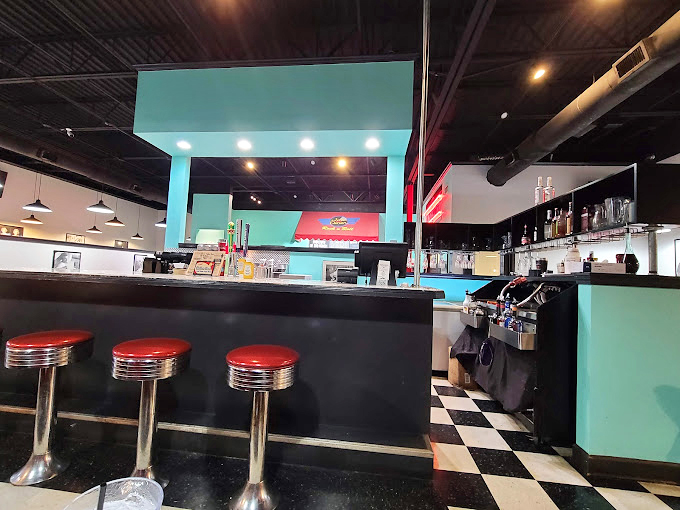 The counter seating offers a front-row view to the culinary theater—where breakfast dreams are fulfilled and diet plans go to die gloriously.