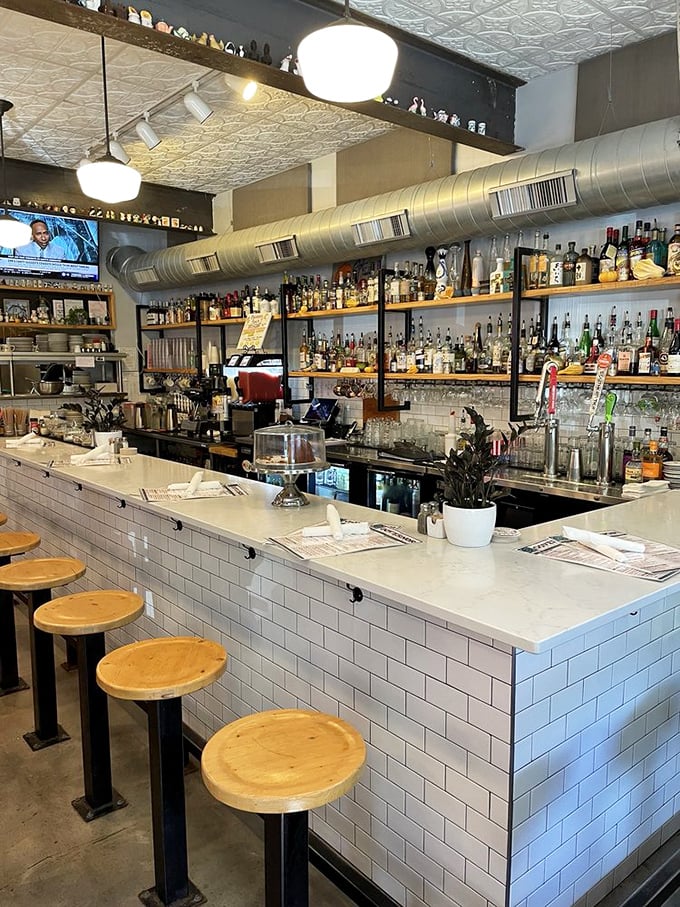The bar isn't just well-stocked—it's a liquid library of possibilities. Clean lines, warm wood, and the promise of perfectly crafted drinks await.