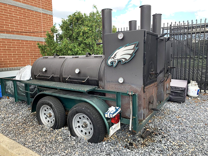The heart of the operation: an Eagles-adorned smoker that's seen more action than a linebacker, turning meat into memories one cook at a time.