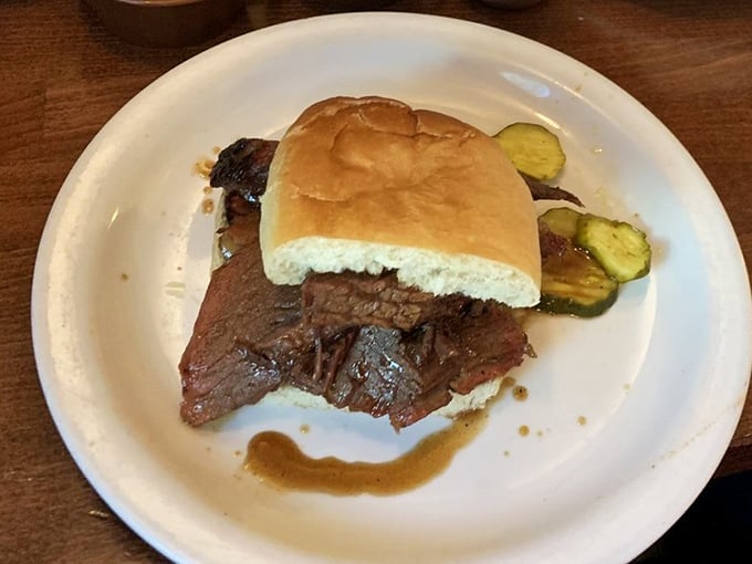 The brisket sandwich—architectural simplicity at its finest. Just meat, bread, and the courage to face the inevitable sauce drip down your arm.