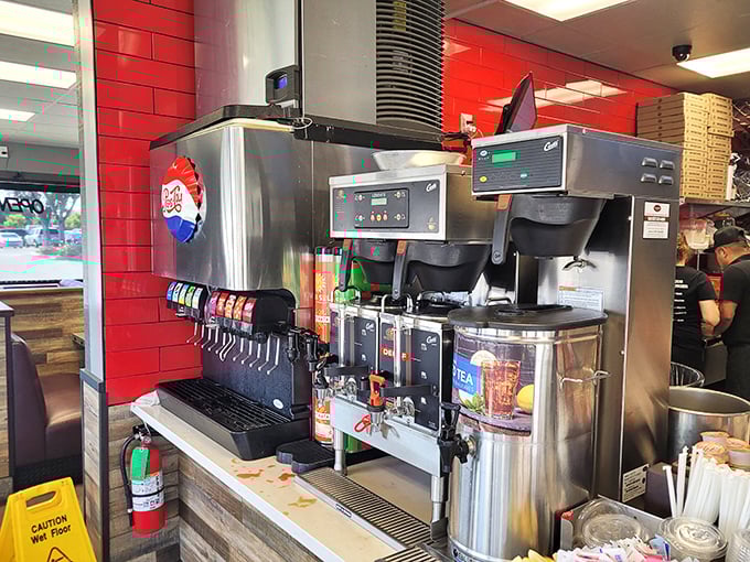 The soda fountain of youth – where free refills and endless flavor combinations fuel conversations that last long after the meal is over.