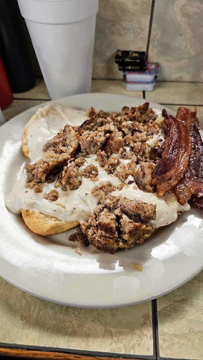 Biscuits and gravy with a side of bacon—the Southern breakfast trifecta that's converted more Yankees than the Civil War ever did.