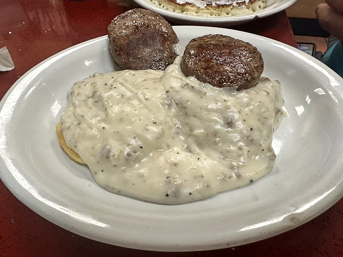 Biscuits and gravy – the Southern breakfast classic that proves sometimes the most humble-looking dishes deliver the most profound comfort.