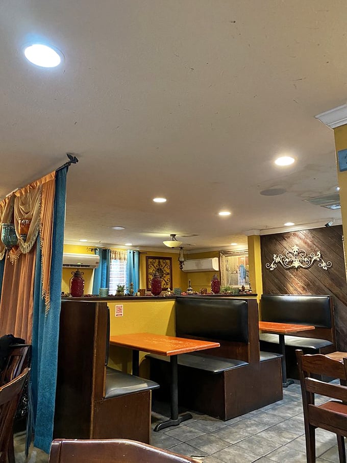 The booths at Aladdin offer that perfect blend of privacy and community—close enough to admire your neighbor's kebab plate, far enough to avoid sharing it.